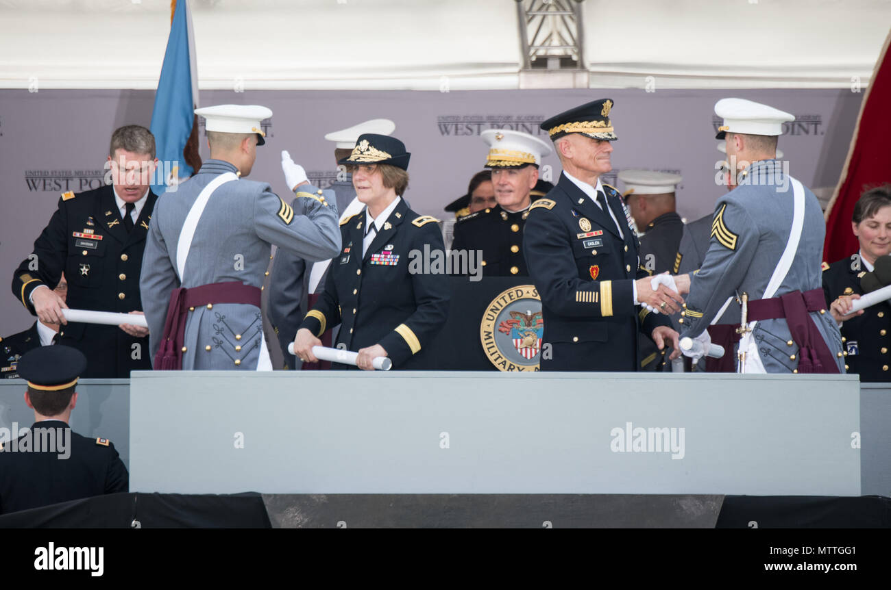 U.S. Military Academy cadets recieve their diplomas during their ...