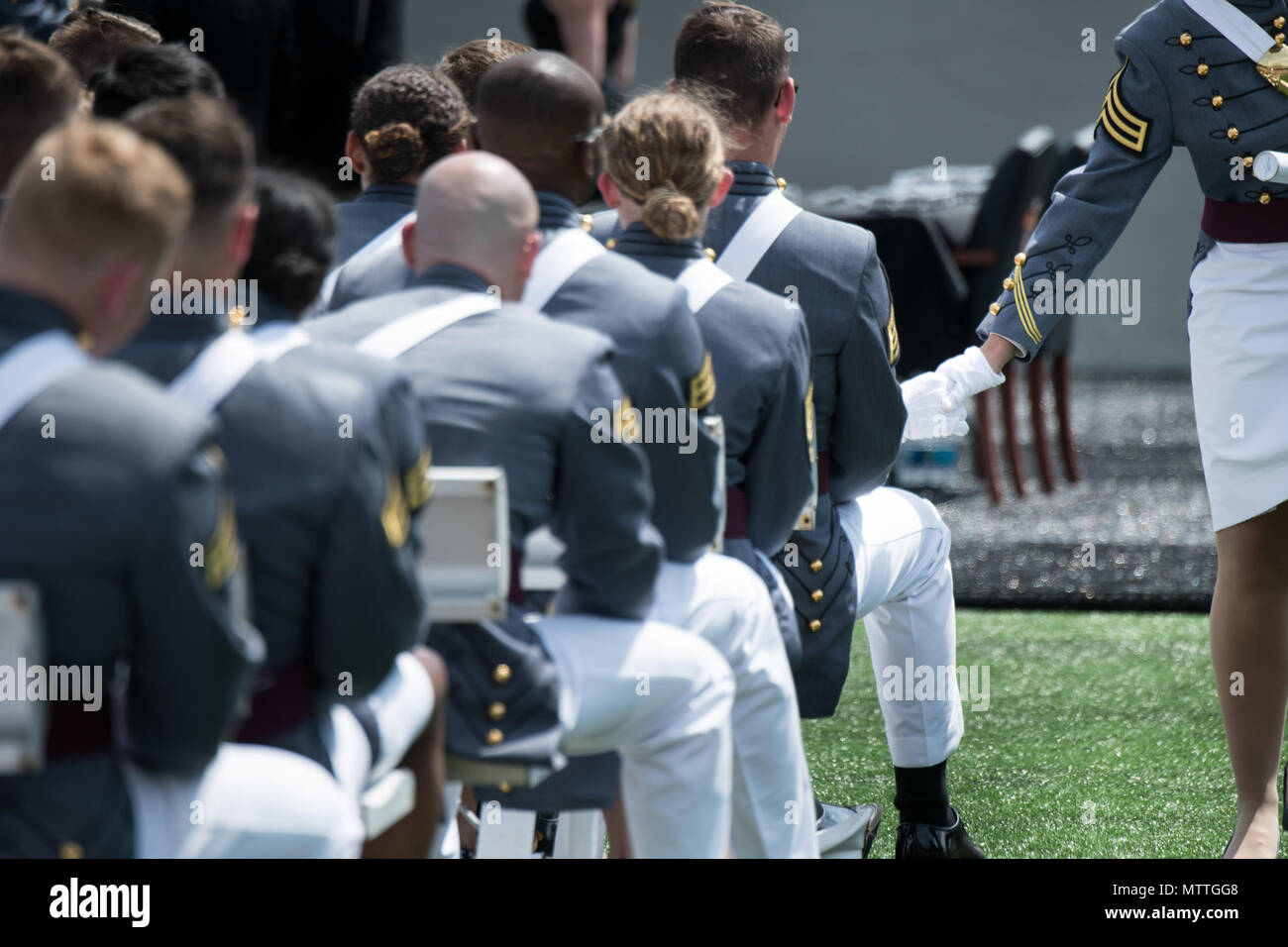 A U.S. Military Academy cadet reacts after recieving their diplomas ...