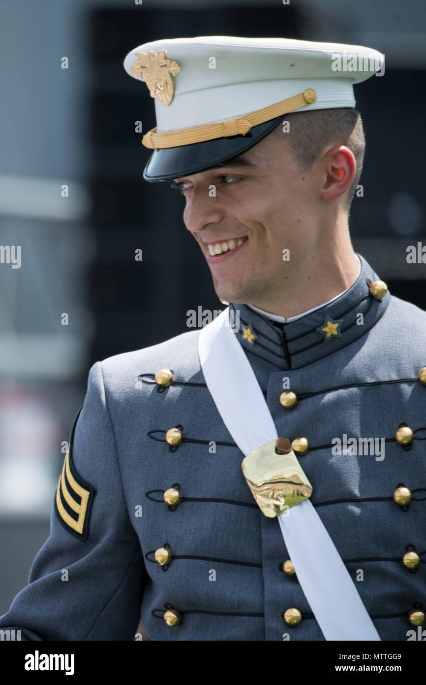 A U.S. Military Academy cadet reacts after recieving their diplomas ...