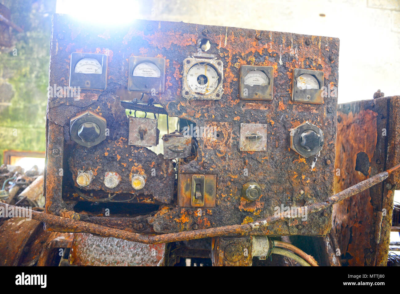 Old control panel rotted away with broken dials and falling apart in an ...