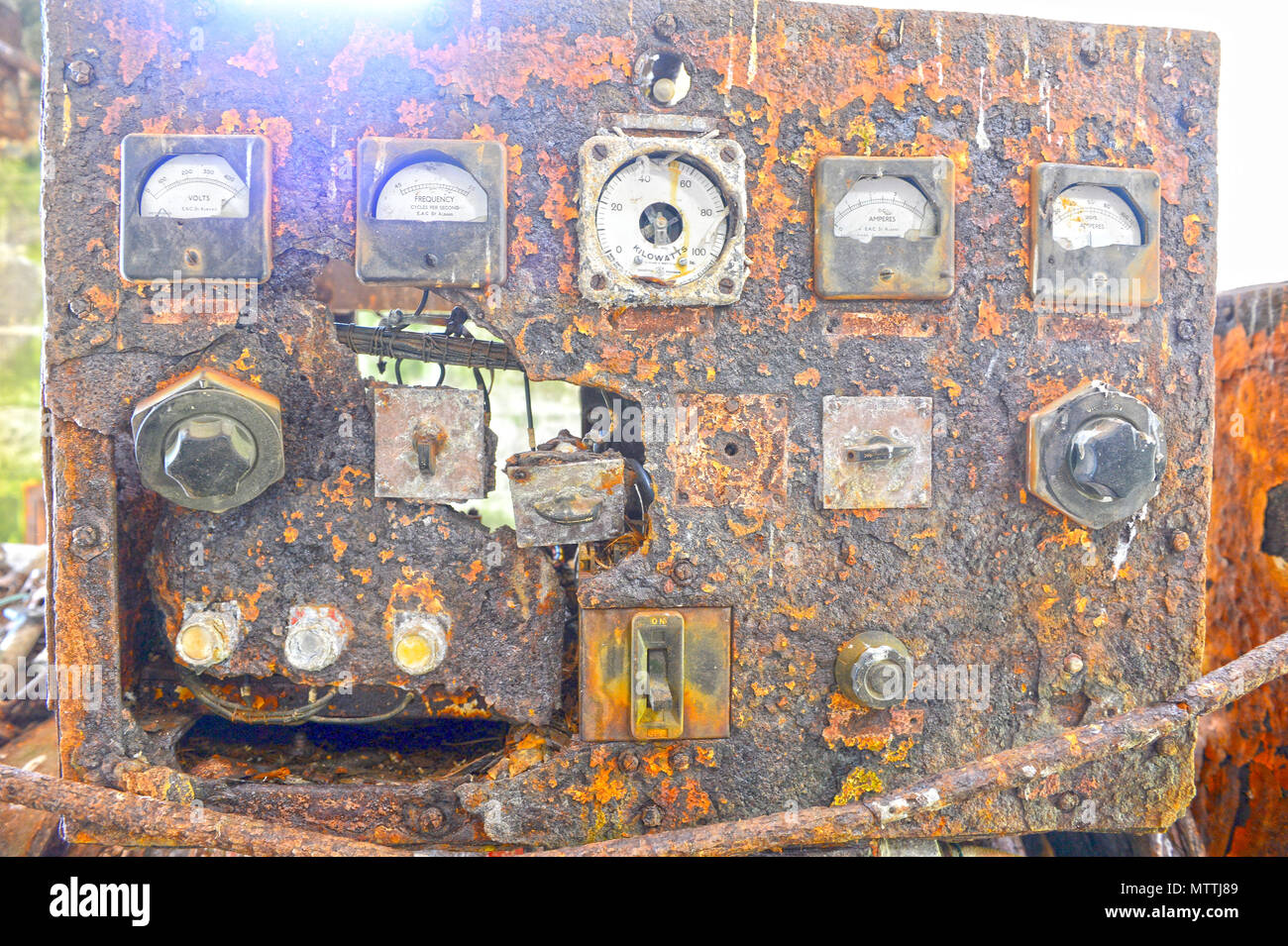 Old control panel rotted away with broken dials and falling apart in an ...