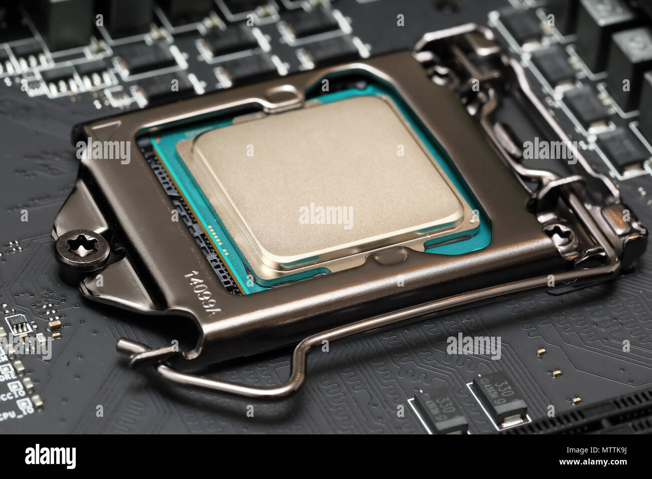 modern central processor unit on motherboard Stock Photo - Alamy