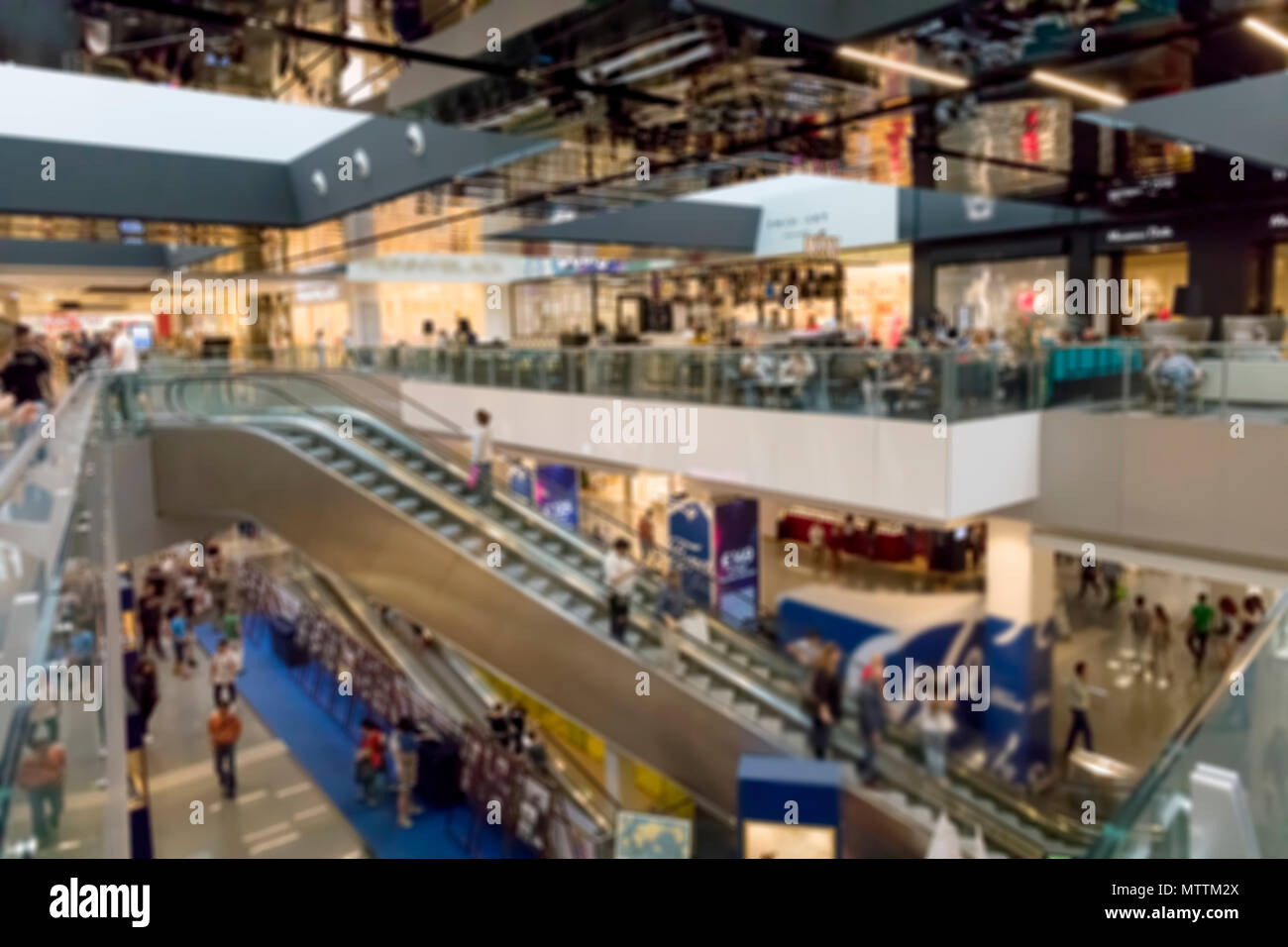 People go shopping inside the shopping center. The spaces with the ...