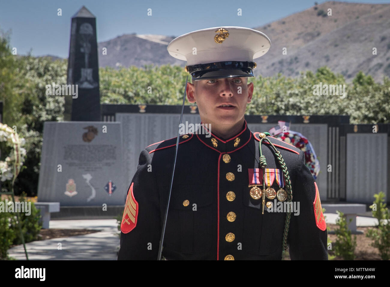 A U.S. Marine with 5th Marine Regiment, 1st Marine Division, marches by ...