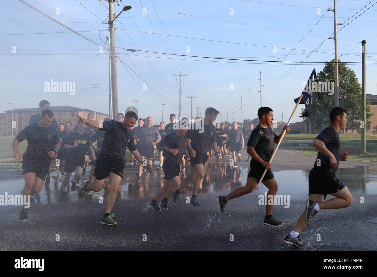 Soldiers from 101st Airborne Division, get sprayed by a hose as they ...