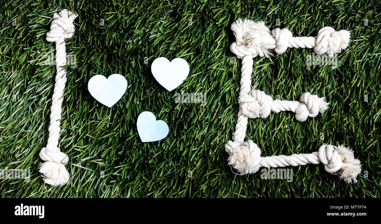 I love E on green grass background Stock Photo - Alamy