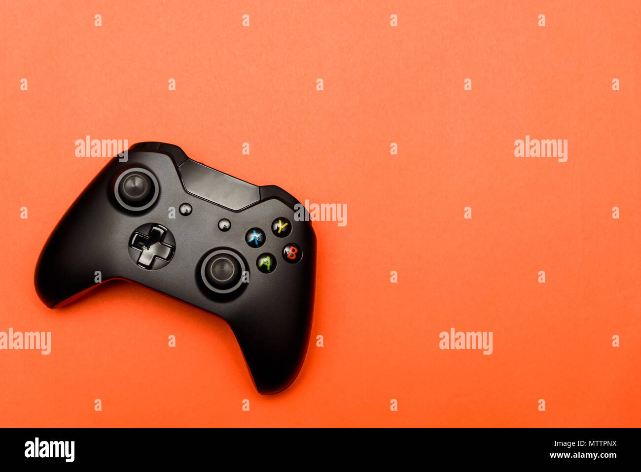 Black joystick on orange textured background. Computer gaming ...