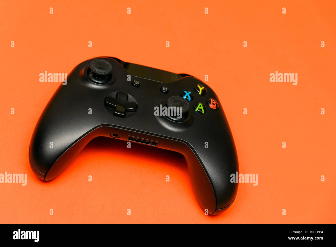 Black joystick on orange textured background. Computer gaming ...