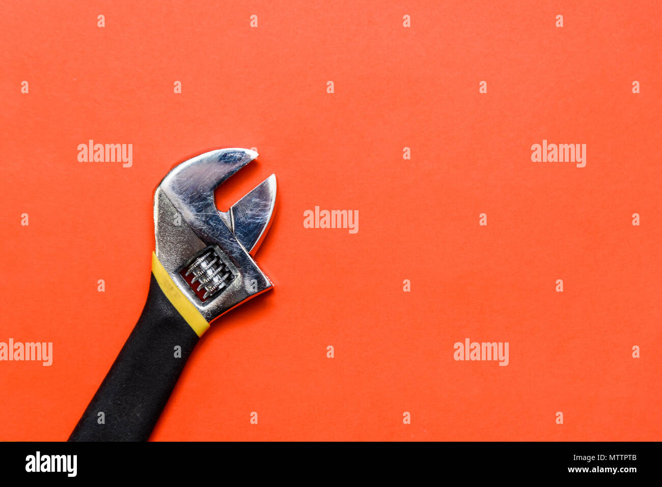 Used Pliers Tools on a orange textured background with space for text ...