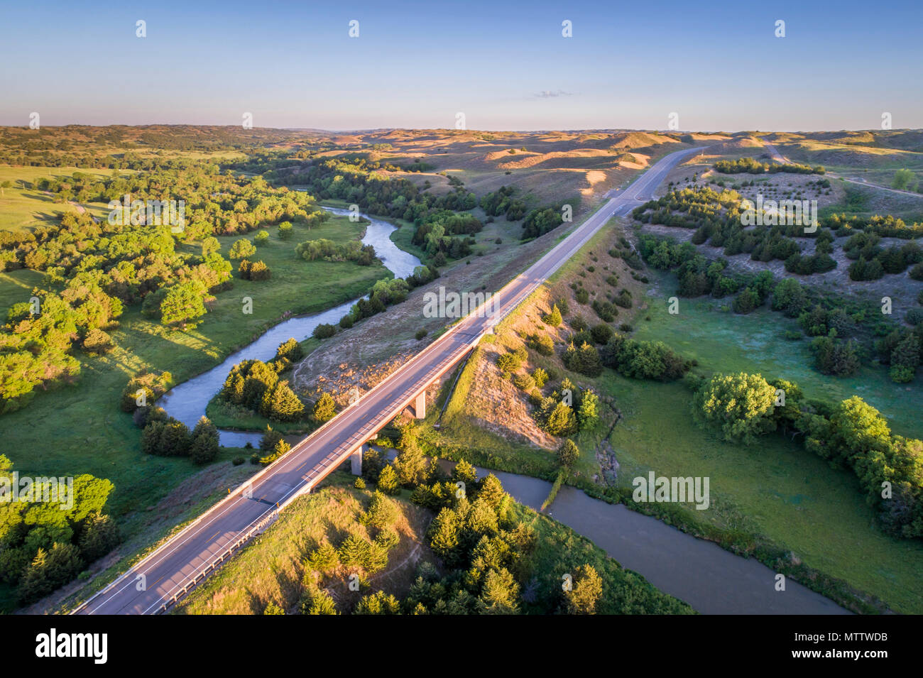 aerial view of a highway and bridge over the Dismal River in Nebraska ...