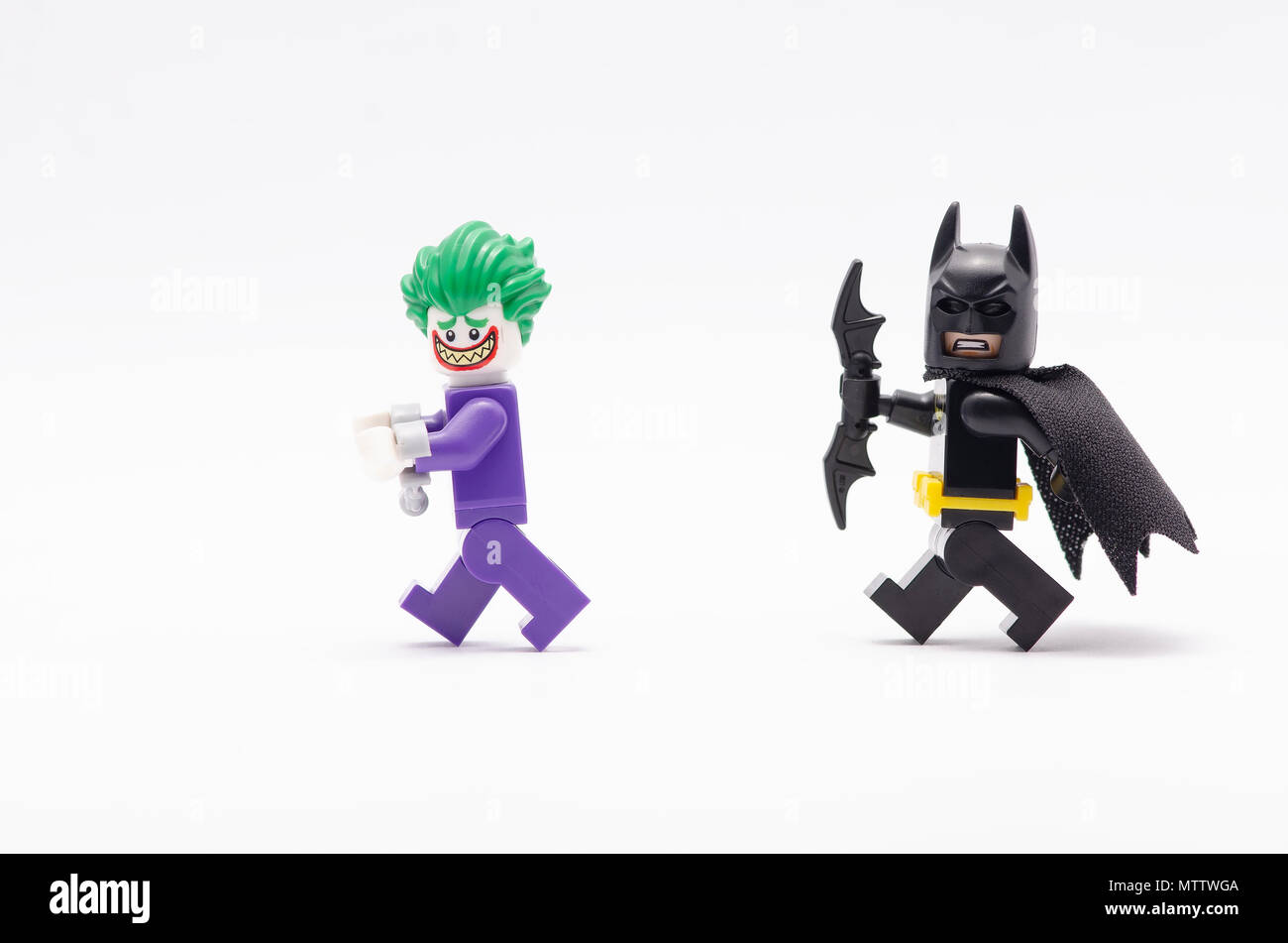 mini figure of batman chasing joker with handcuff. Lego minifigures are ...