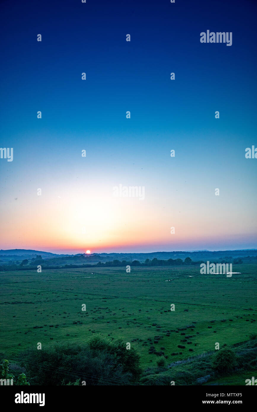Sunset over the countryside in West Sussex in England Stock Photo - Alamy
