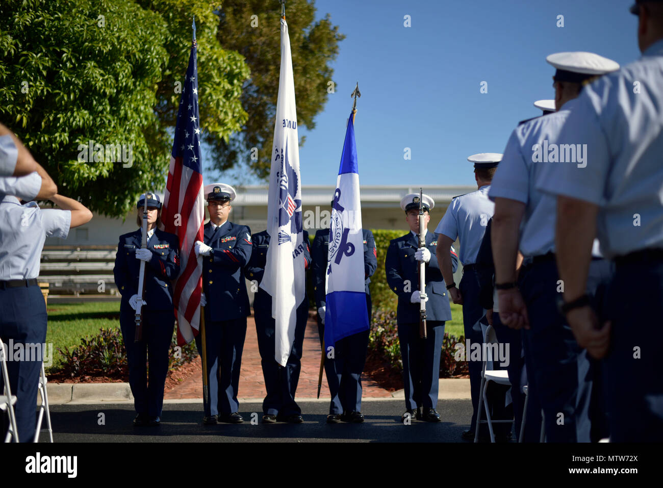 A Coast Guard Sector Miami color guard presents the colors during a ...