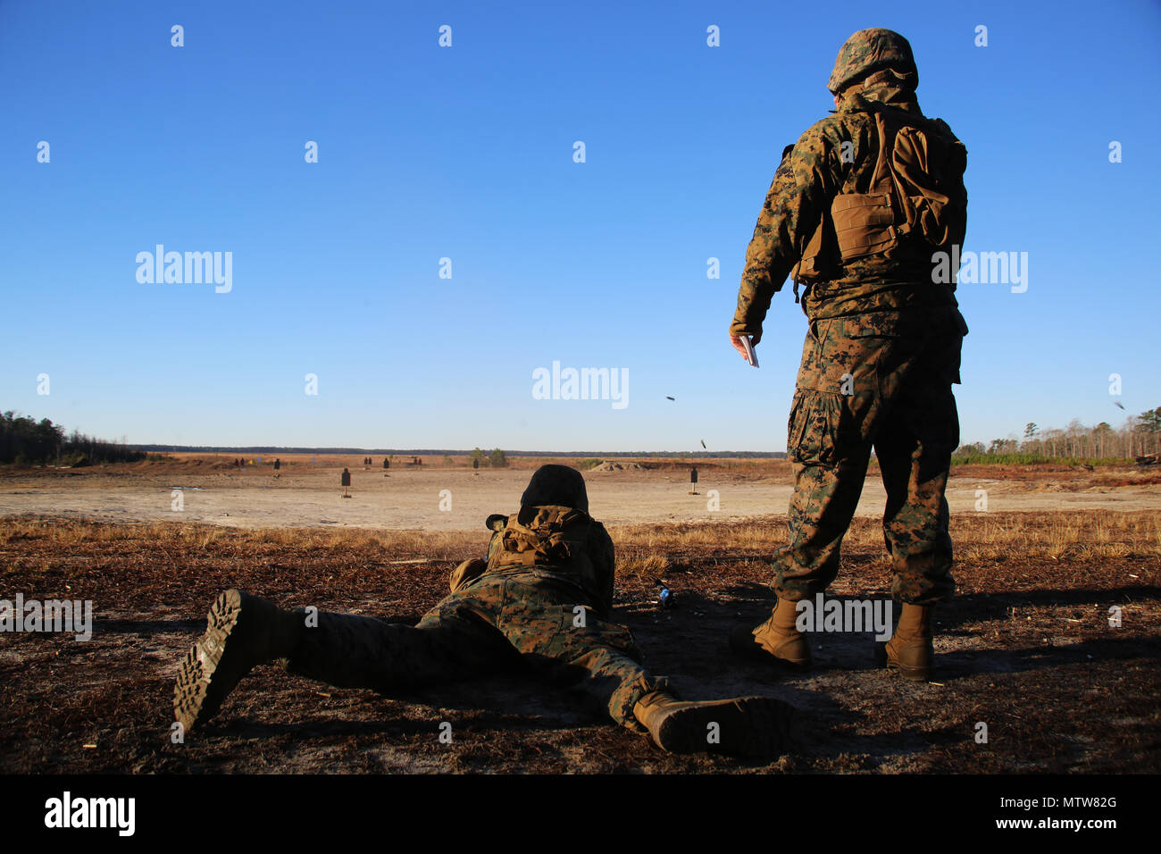 A Marine qualifies on an M294 Squad Automatic Weapon during weapons ...