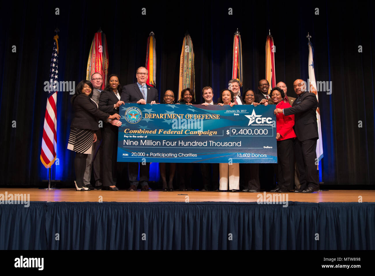 Deputy Secretary of Defense Bob poses for a photo with the total sum of ...