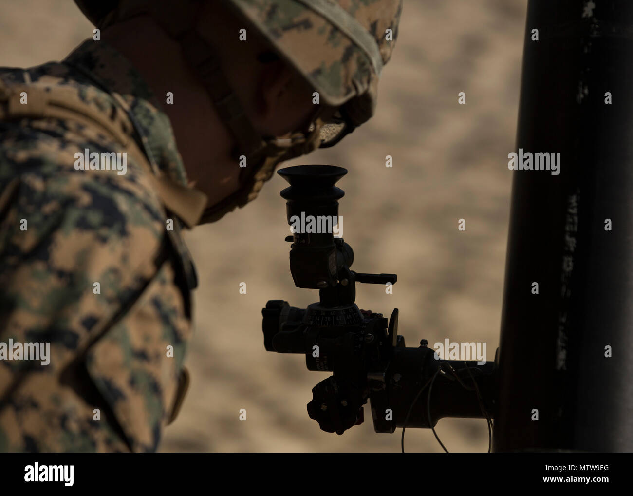 A Marine with Task Force Southwest adjusts fire on an M121 A1 120mm ...
