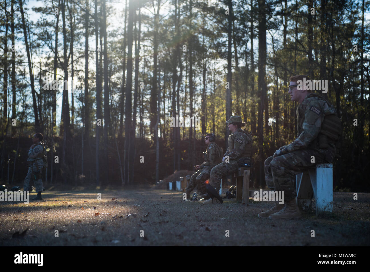 Airmen from the 1st Combat Camera Squadron rest during a lull in ...