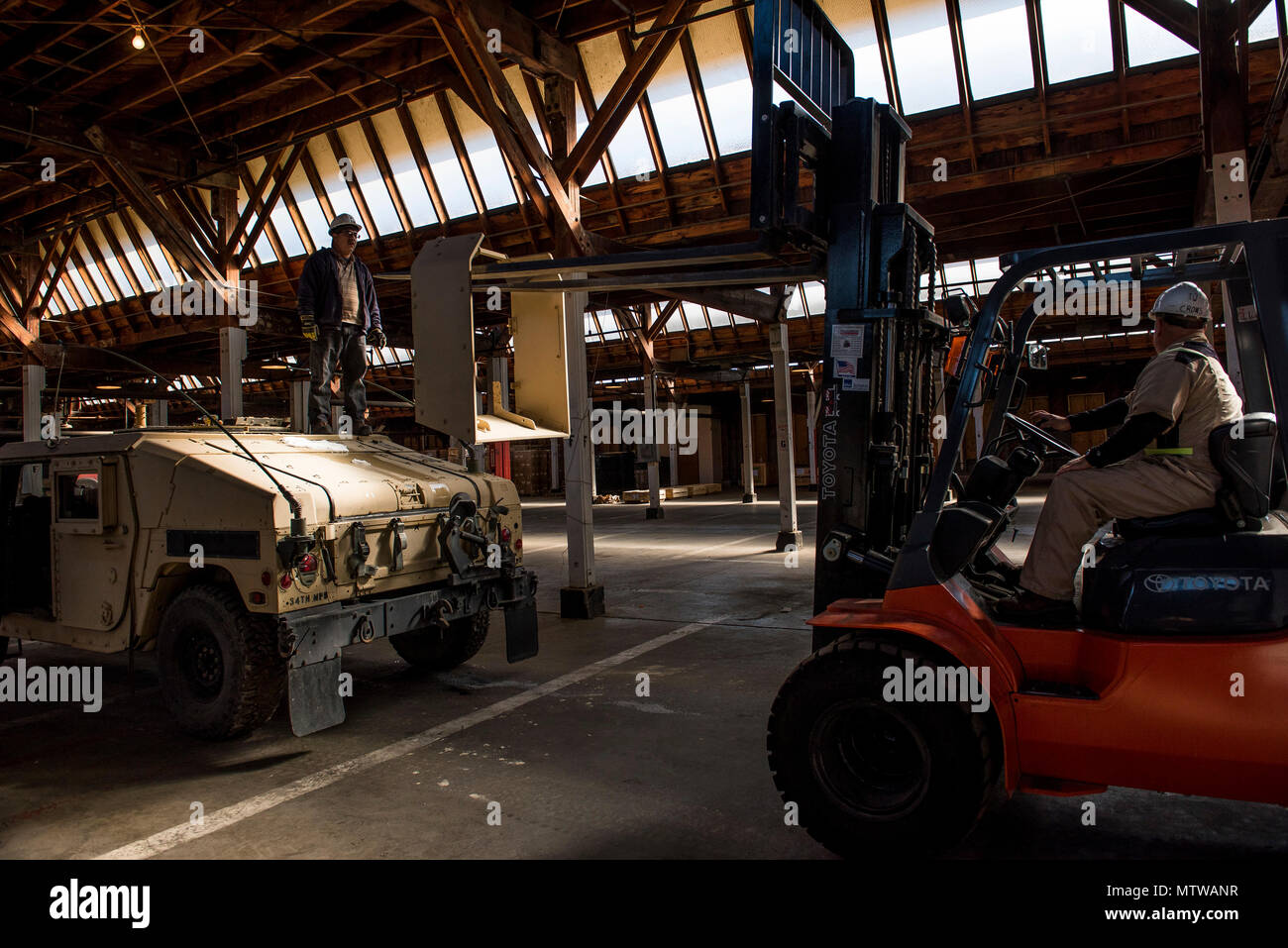 Installers for the Materiel Fielding & Training Team remove the gunner ...