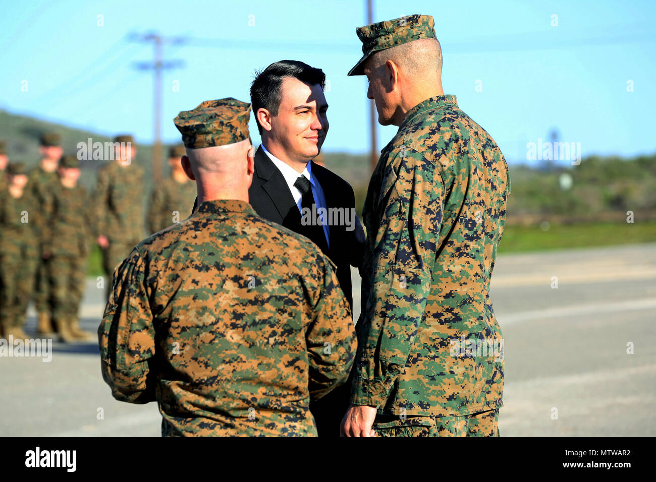 Sgt. Zachary L. Piepenhagen (center), is congratulated by Maj. Gen ...