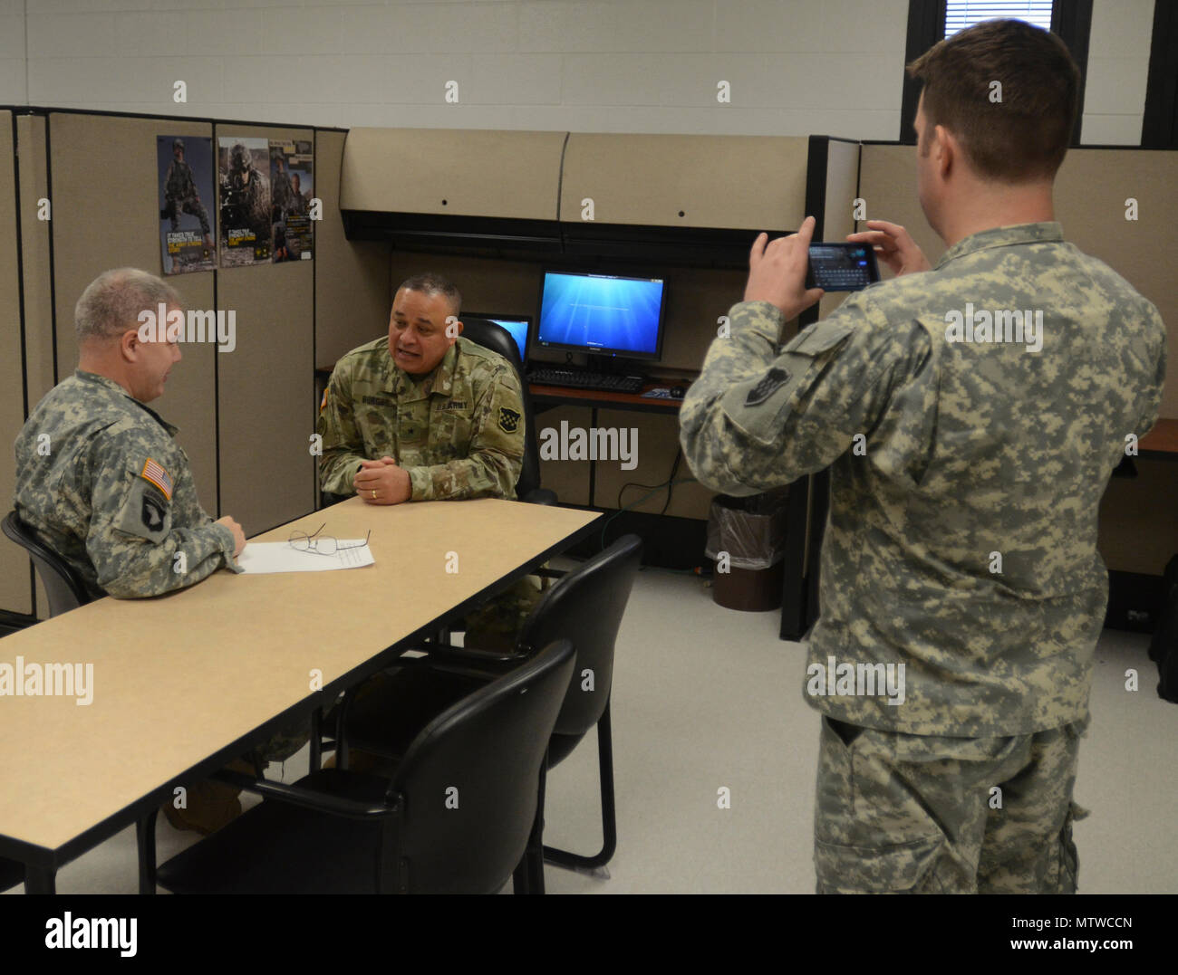 U.S. Army Reserve Sgt. 1st Class Daniel Symonds (left) and Staff Sgt ...