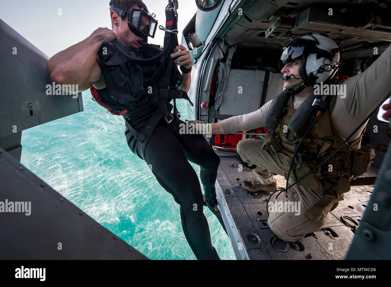 Naval Aircrewman (Helicopter) 2nd Class Nicholas Flynn hoists Naval ...