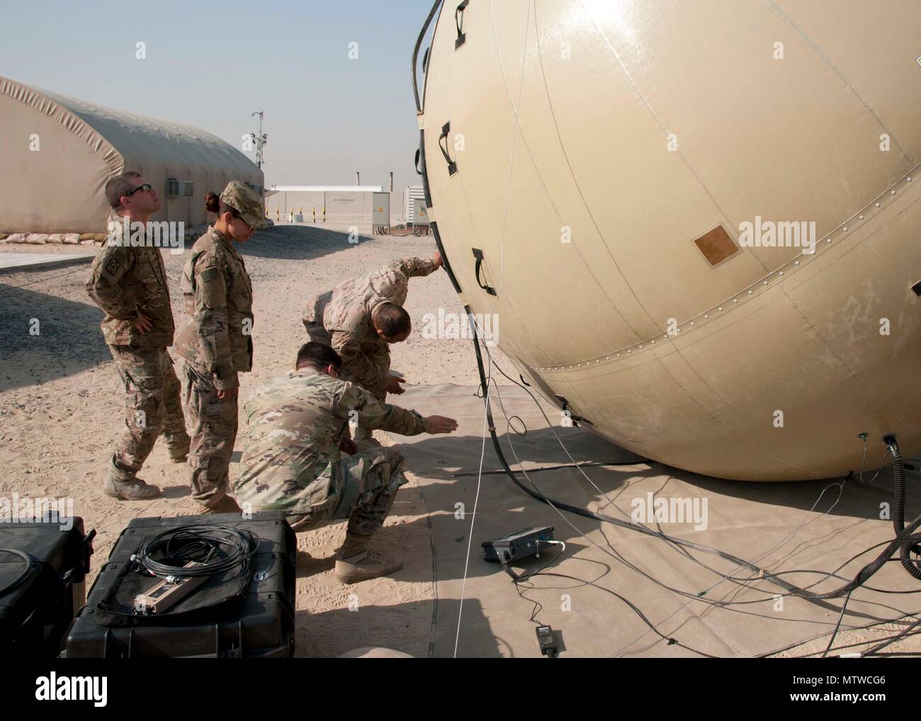 Signal Soldiers of the 369th Sustainment Brigade practice aligning a ...