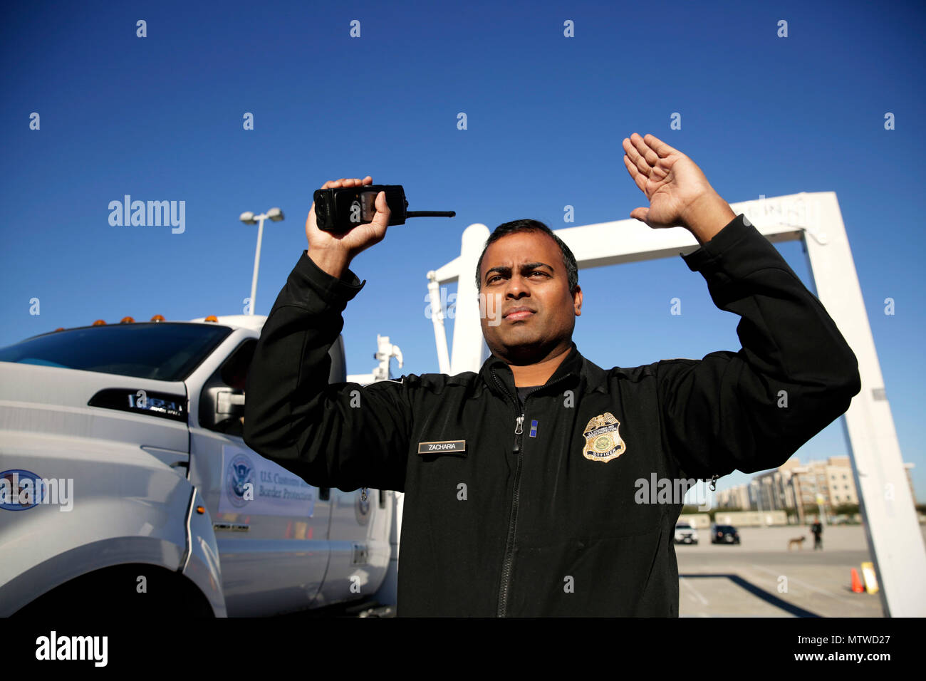 On 30 January 2017, a U.S. Customs and Border Protection officer guided ...