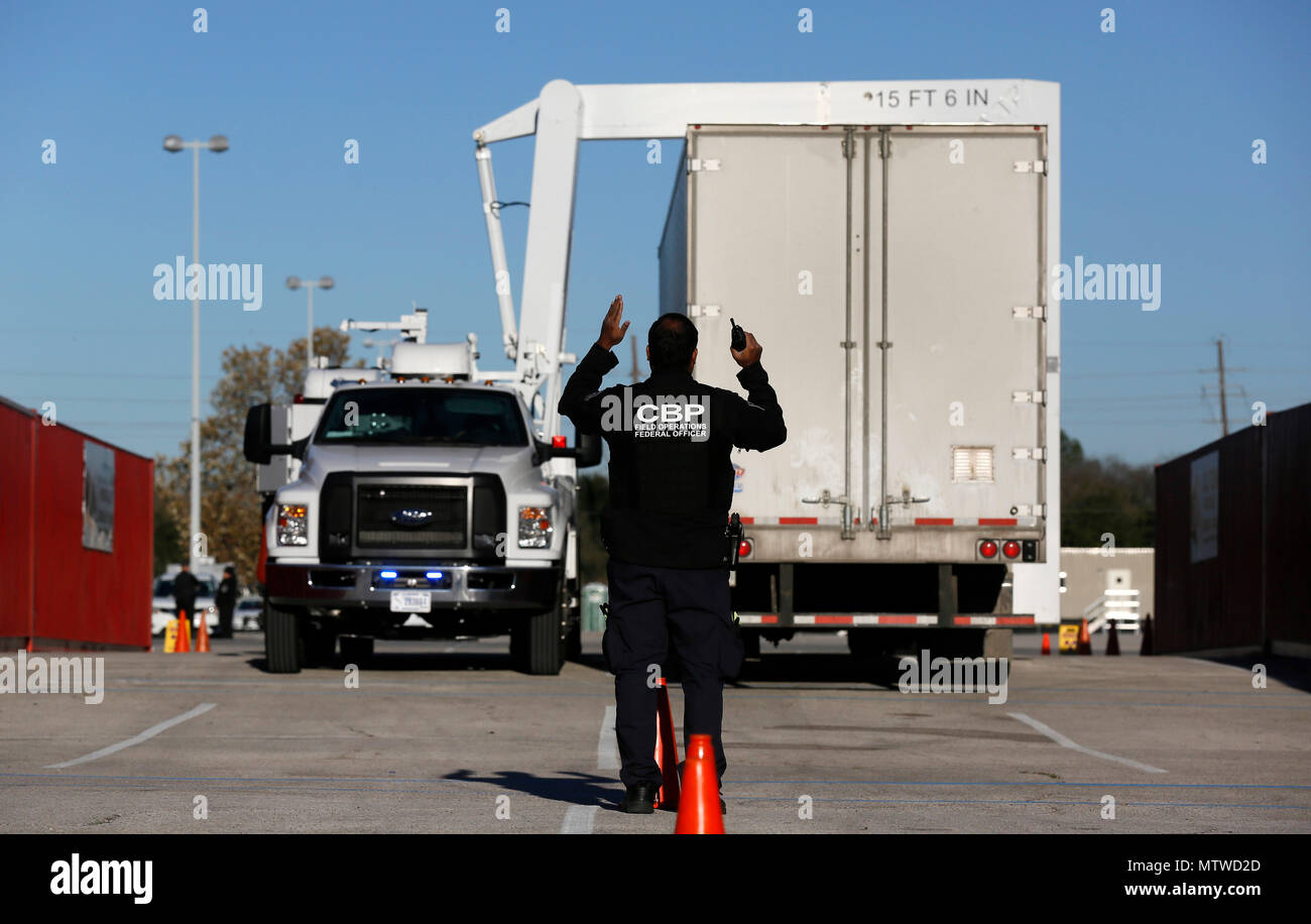 An officer with the U.S. Customs and Border Protection Office of Field ...
