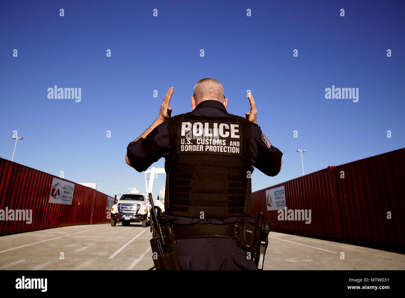 An officer with the U.S. Customs and Border Protection Office of Field ...