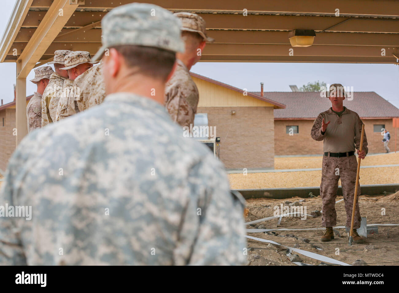 Maj. Chris Ferguson briefs Marines and Soldiers during a rehearsal of ...