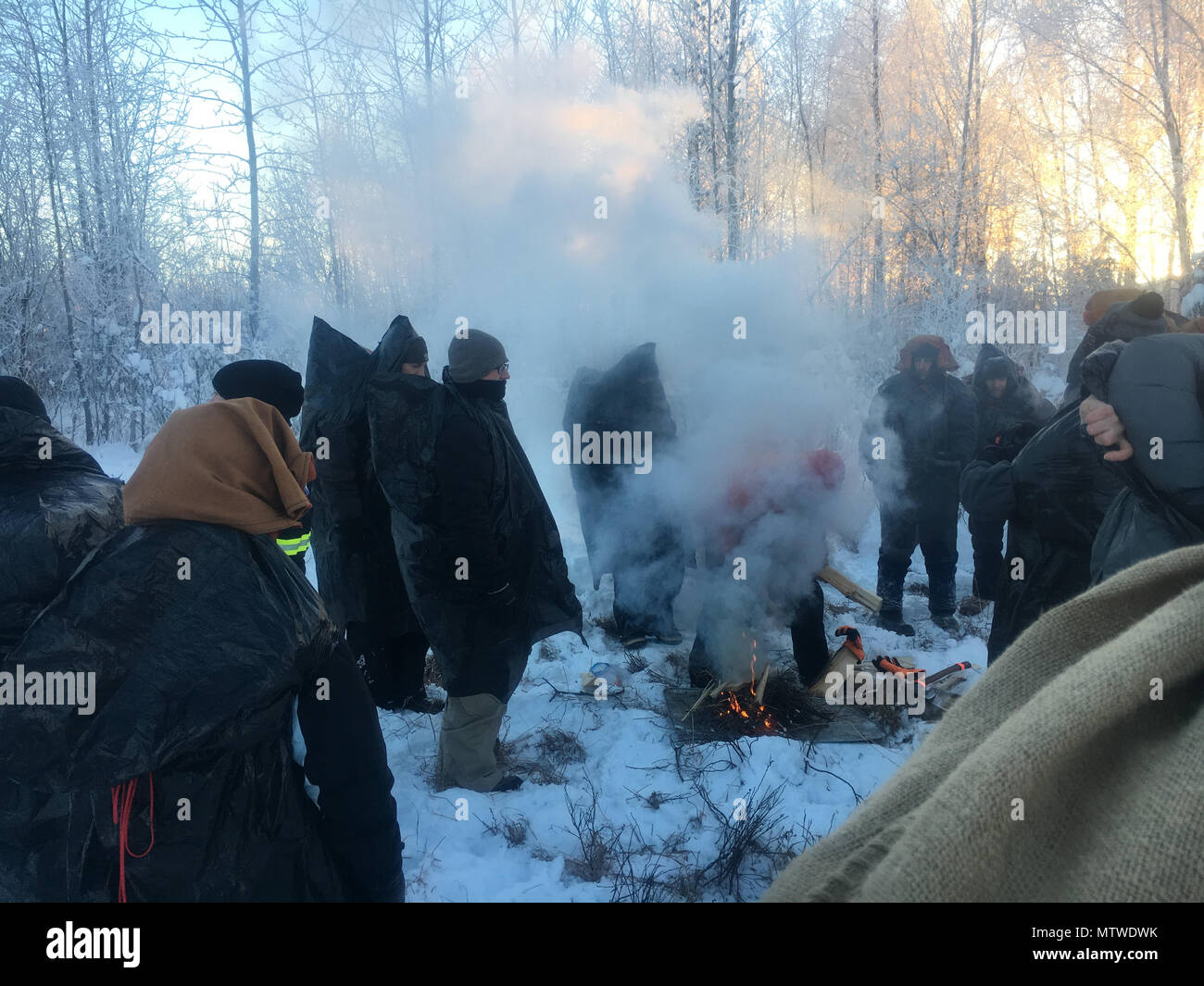 Huddle around the fire hi-res stock photography and images - Alamy