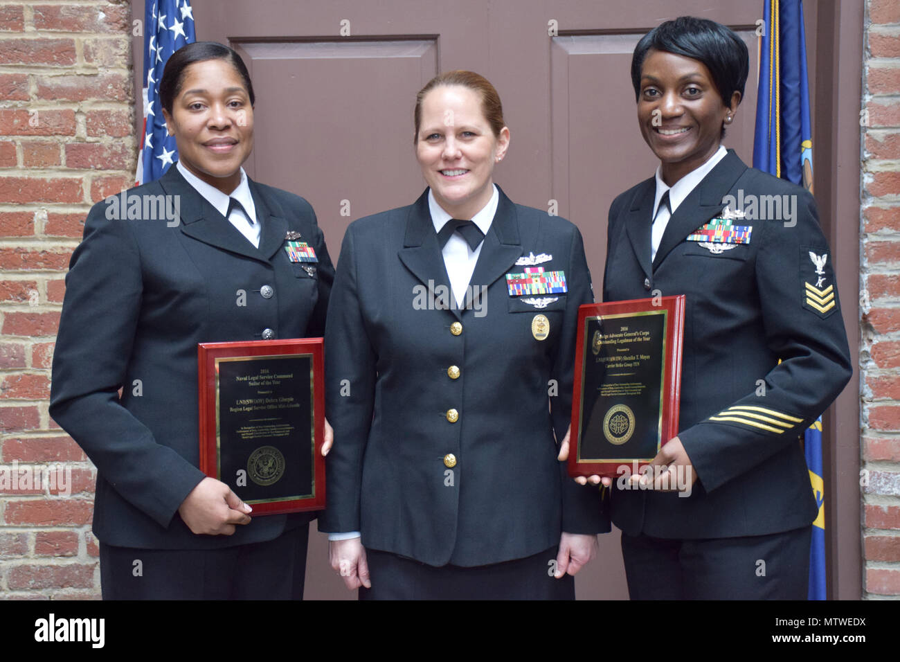 Command Master Chief Jondell Ritchie, Naval Legal Service Command poses for a photo with ...