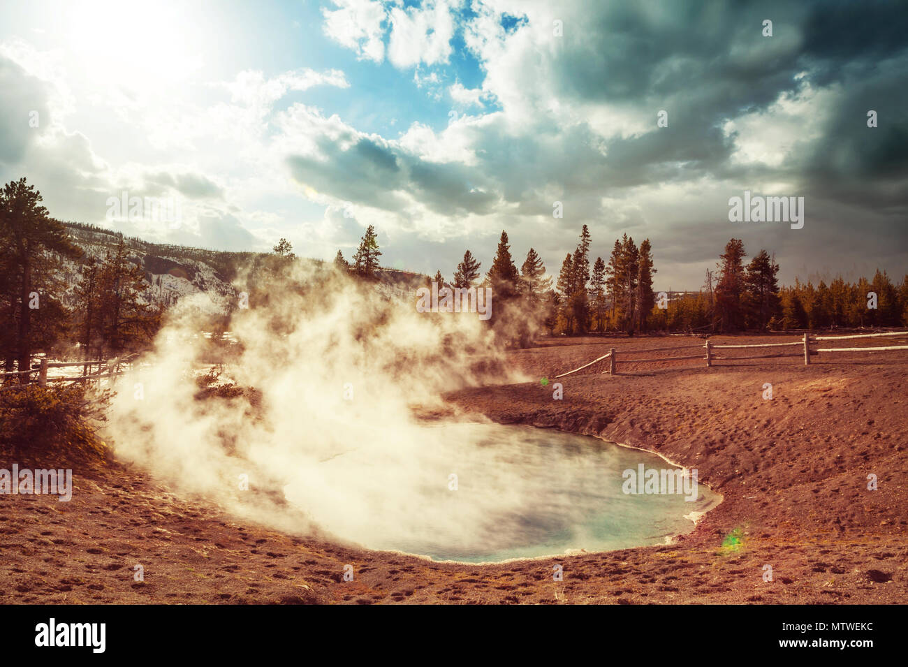 Wooden boardwalk along geyser fields in Yellowstone National Park, USA ...