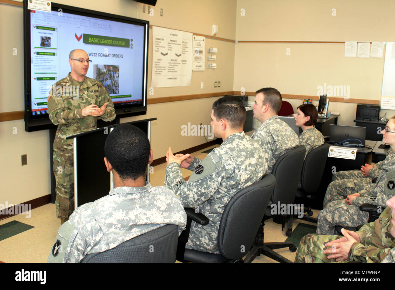 Staff Sgt. Kevin Hopper (standing), instructor for the Basic Leader ...