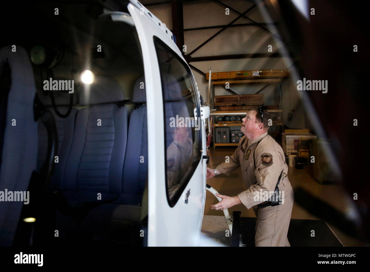 Air Interdiction Agent Cliff Anders performs a pre-flight check of his ...