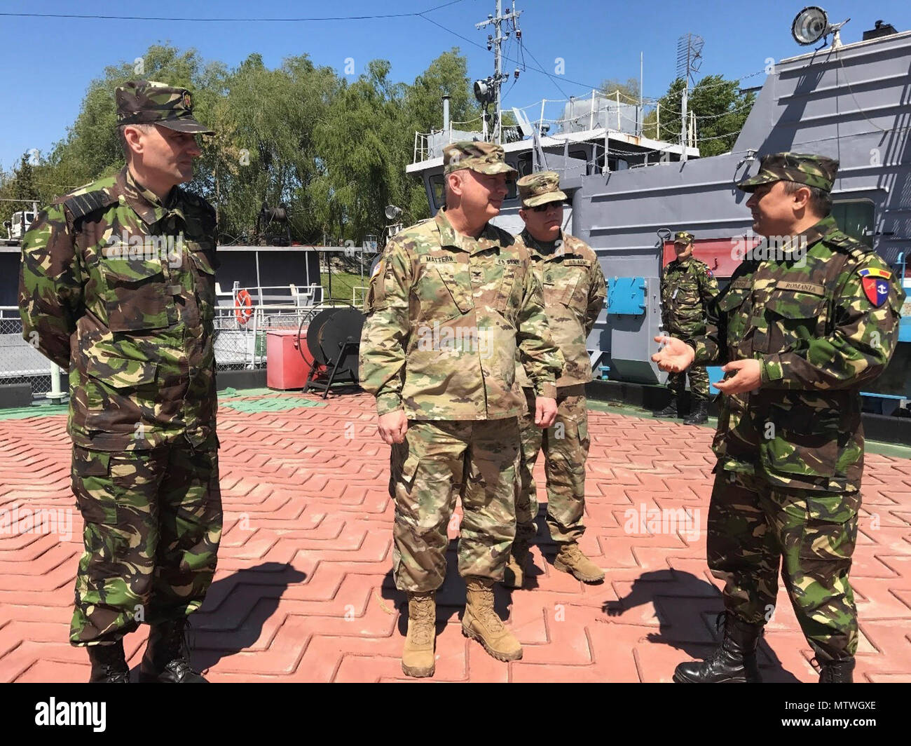 In Braila, Romania, Col. Paul Mattern stands atop the deck of a ...