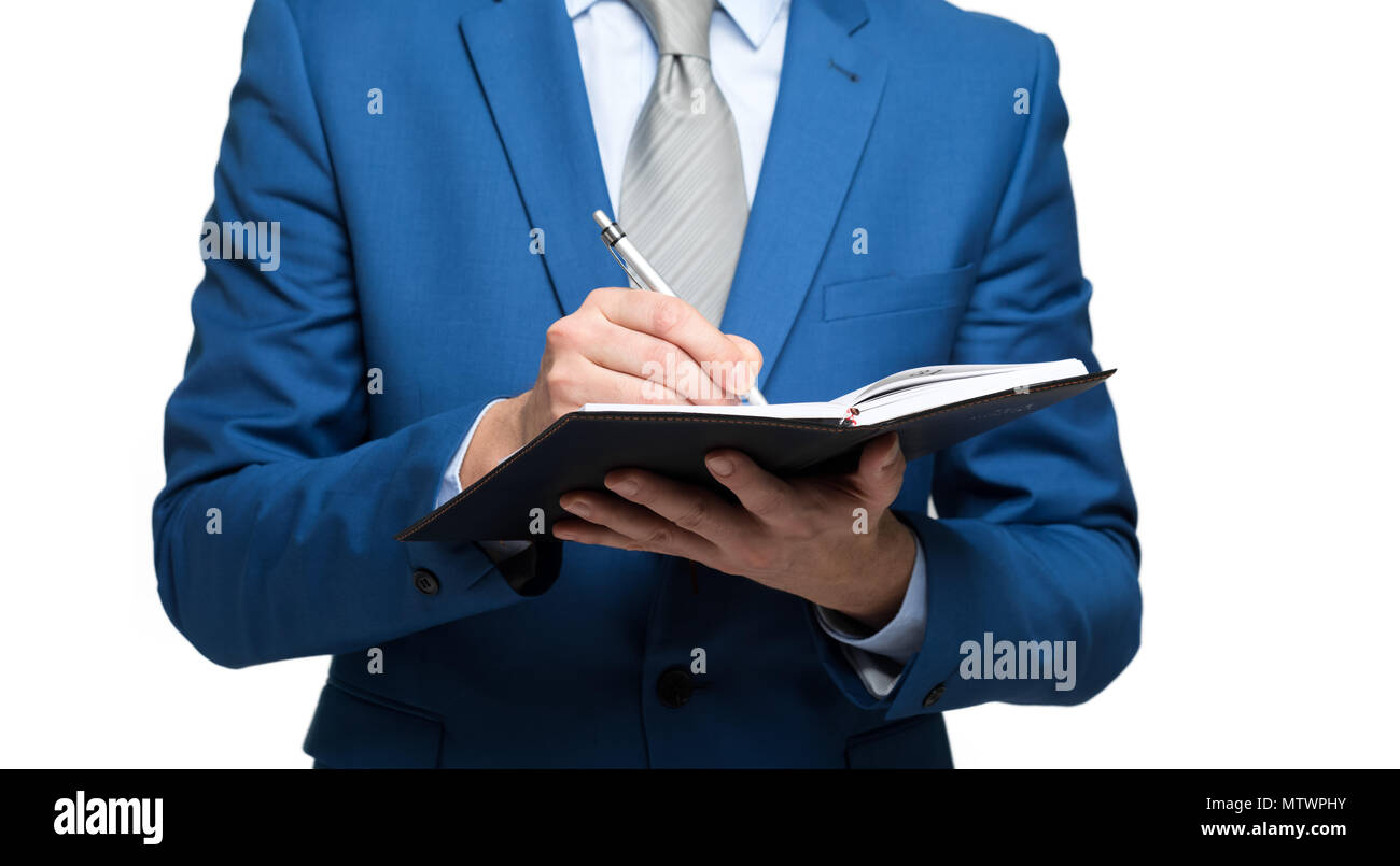 Businessman taking note using pen and notepad Stock Photo - Alamy
