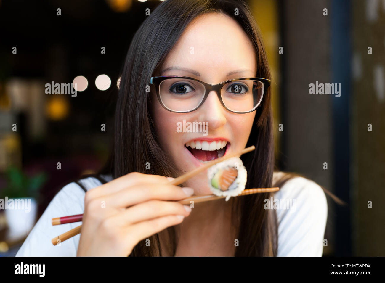 Attractive woman eating seafood hi-res stock photography and images - Alamy