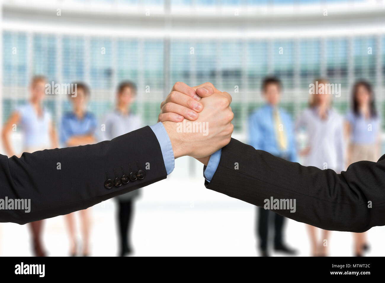Businessman giving aid to another one Stock Photo - Alamy