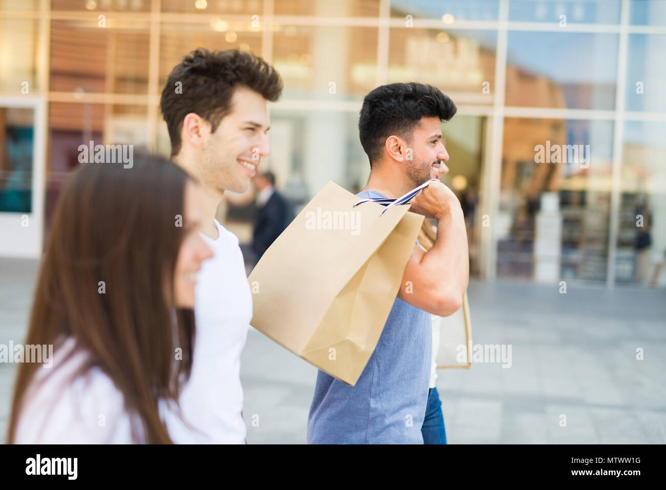 Young man group friends shopping hi-res stock photography and images ...