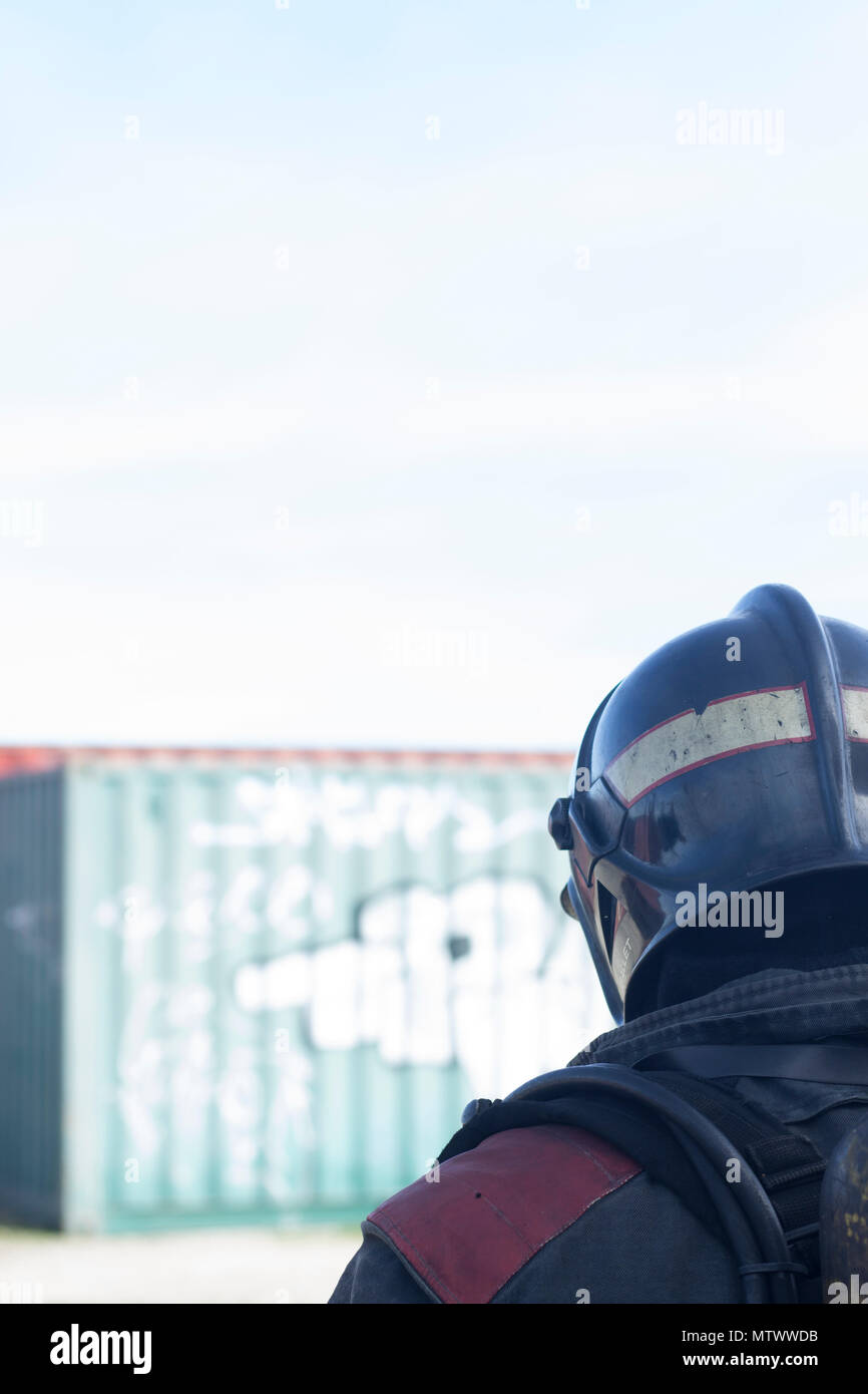 Firefighter putting out fire training station extinguisher backdraft ...