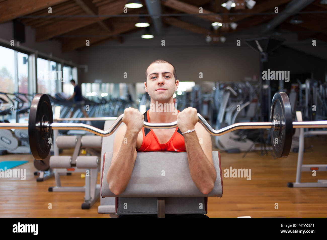 Fitness man working out in a gym Stock Photo - Alamy
