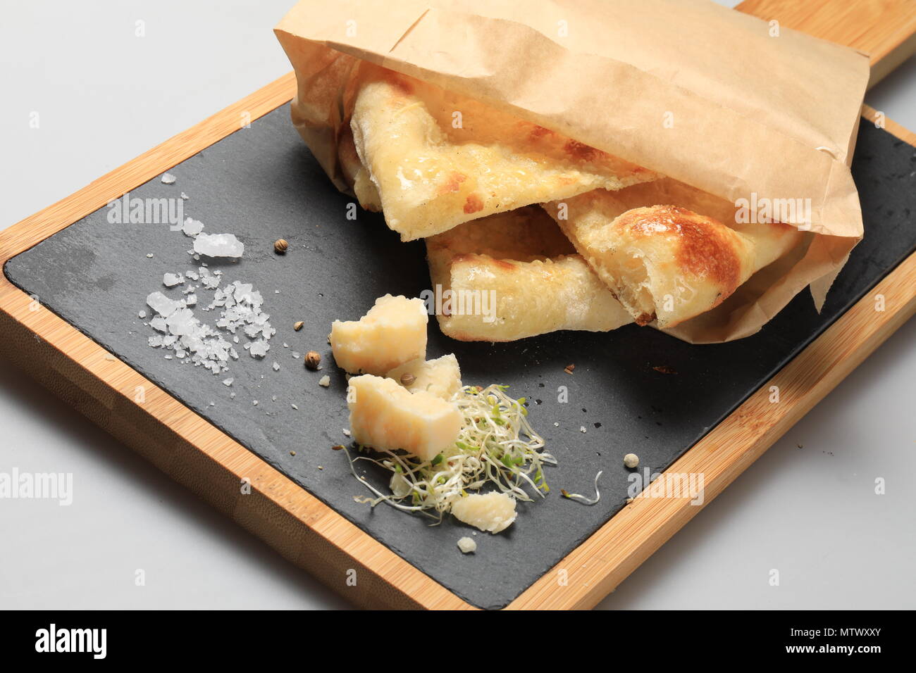 Garlic bread in paper bag Stock Photo - Alamy