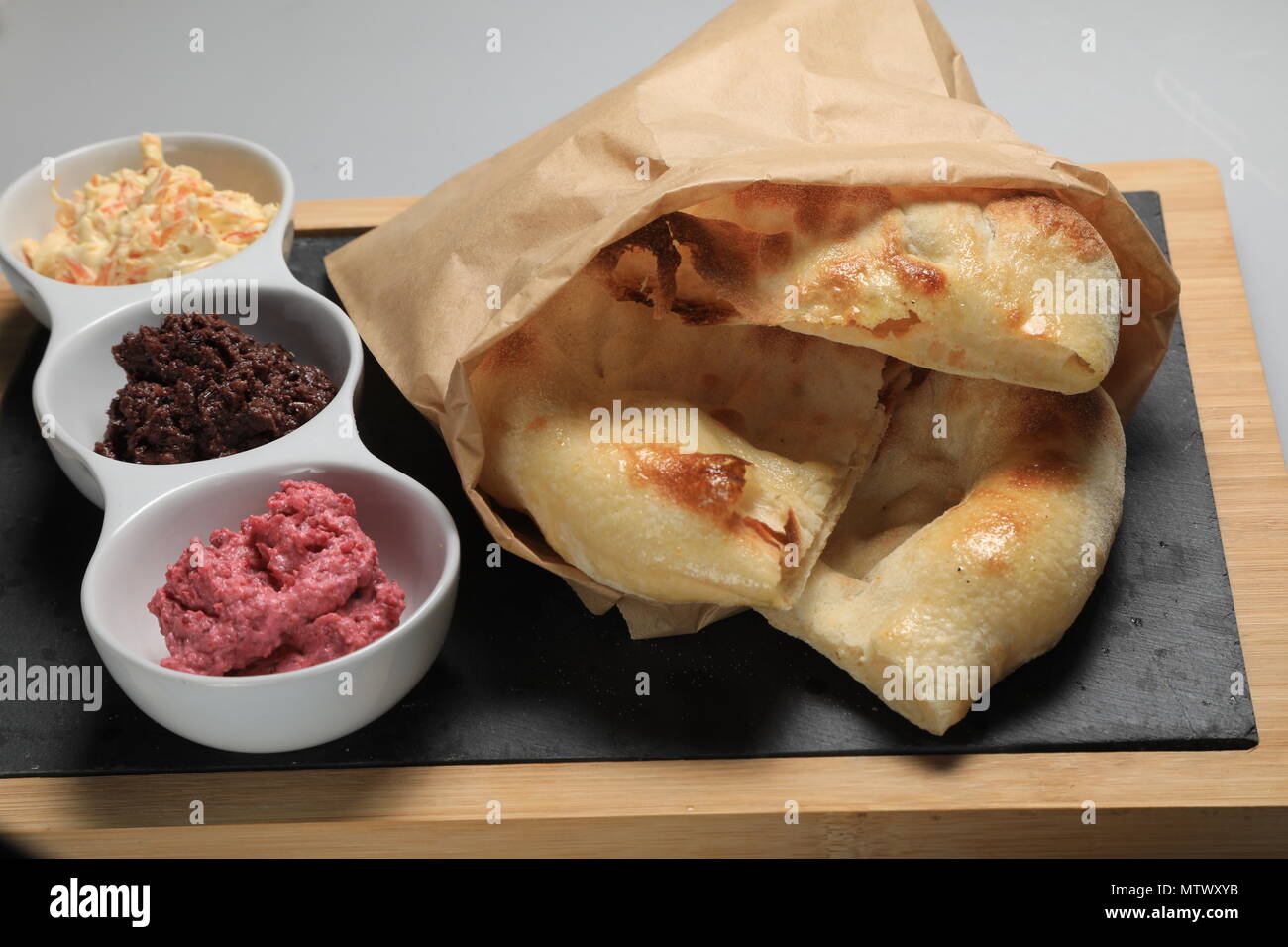 Garlic bread in paper bag Stock Photo - Alamy