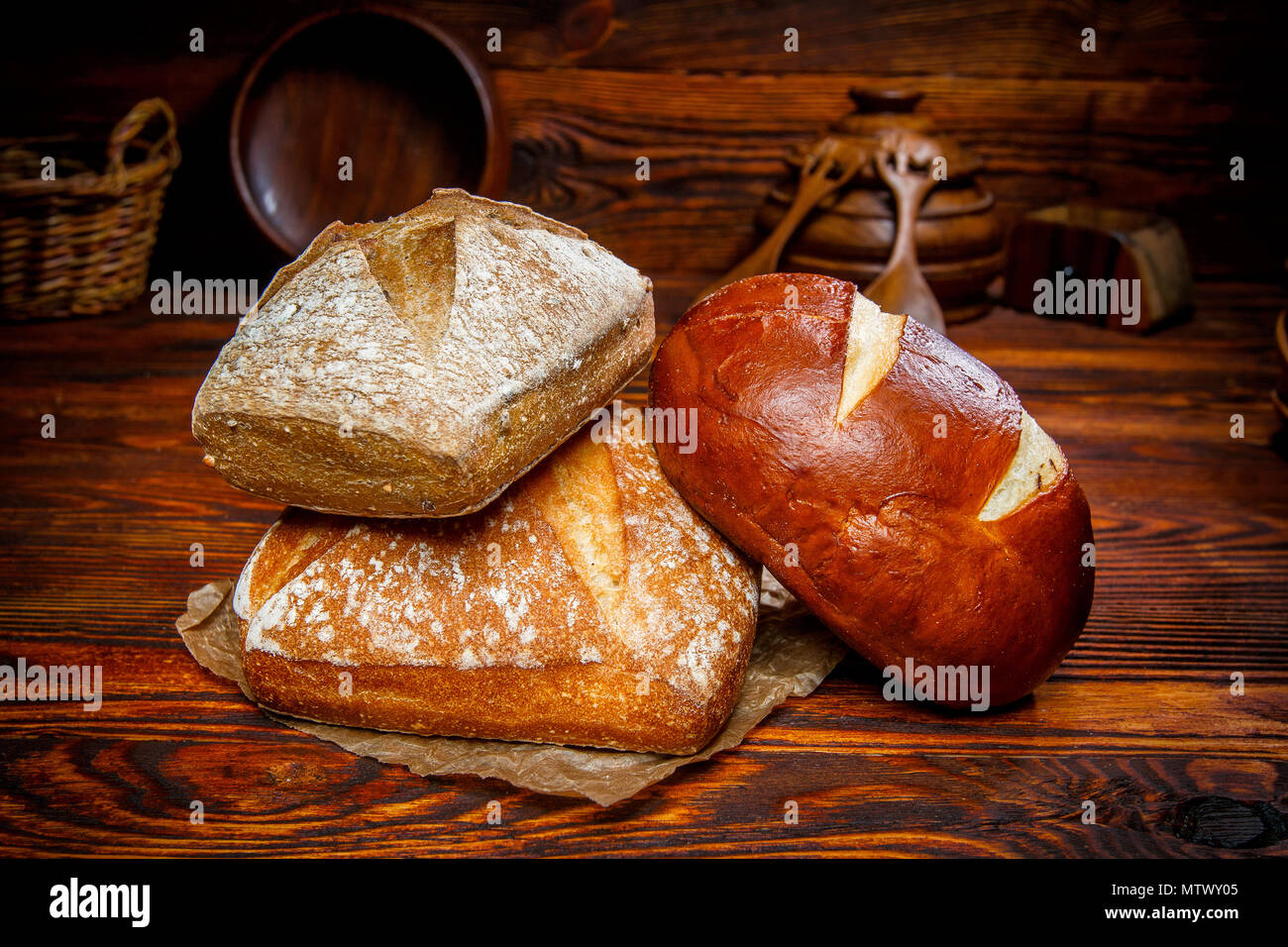 Fresh bread on the table. Stacked on top of each other Stock Photo - Alamy