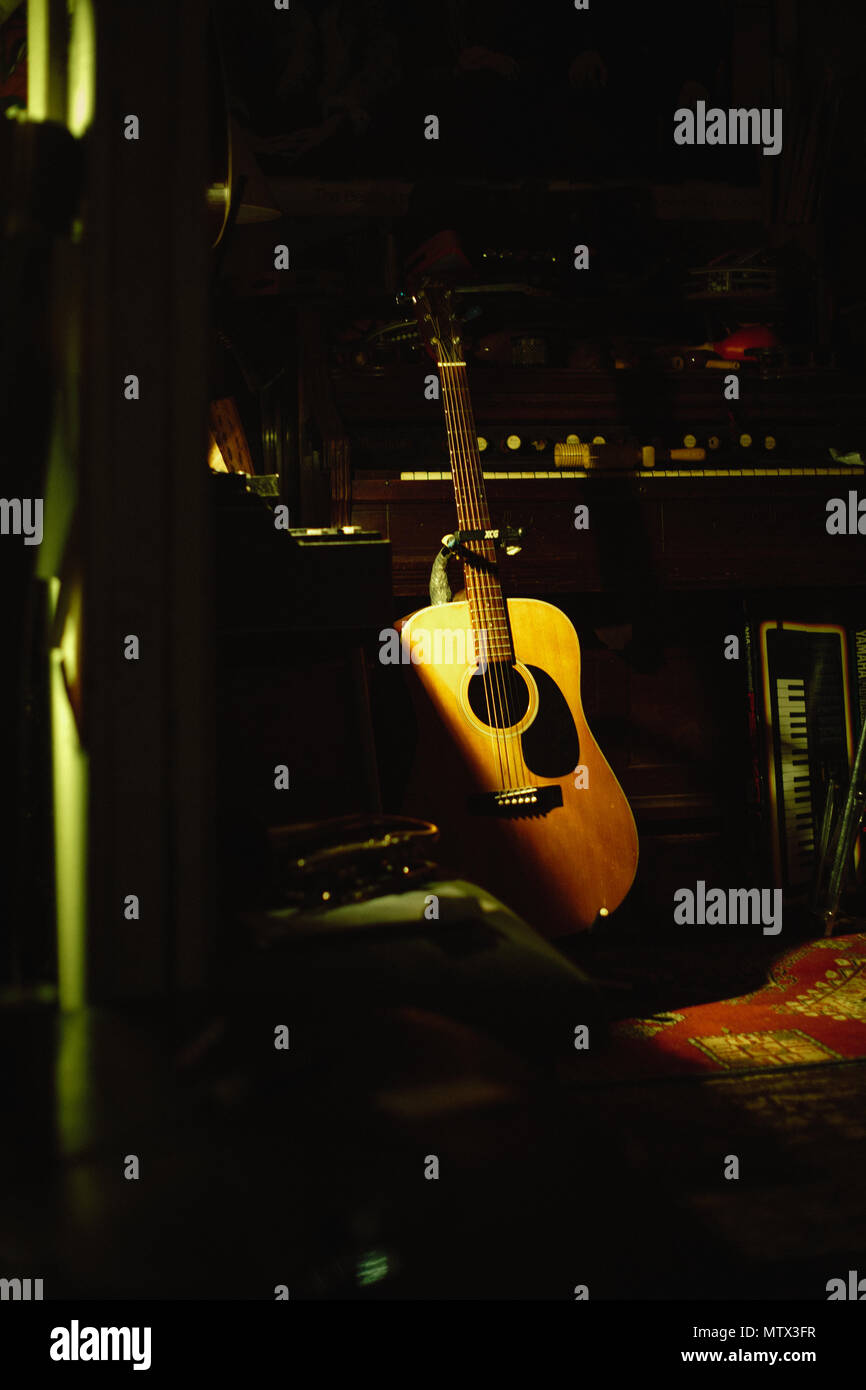 Guitar in shadow Stock Photo - Alamy