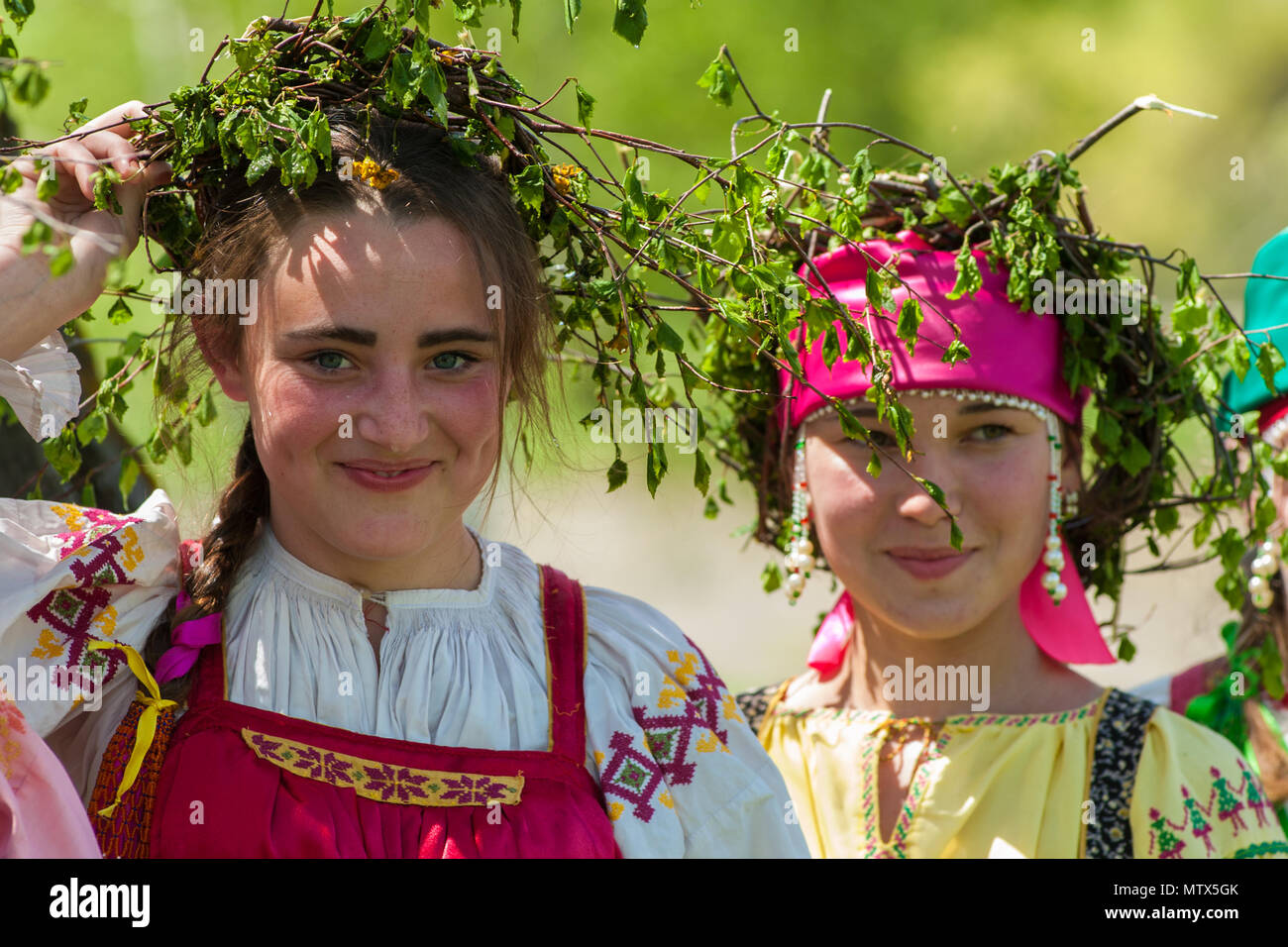 Happy young girls in traditional dress Stock Photo - Alamy