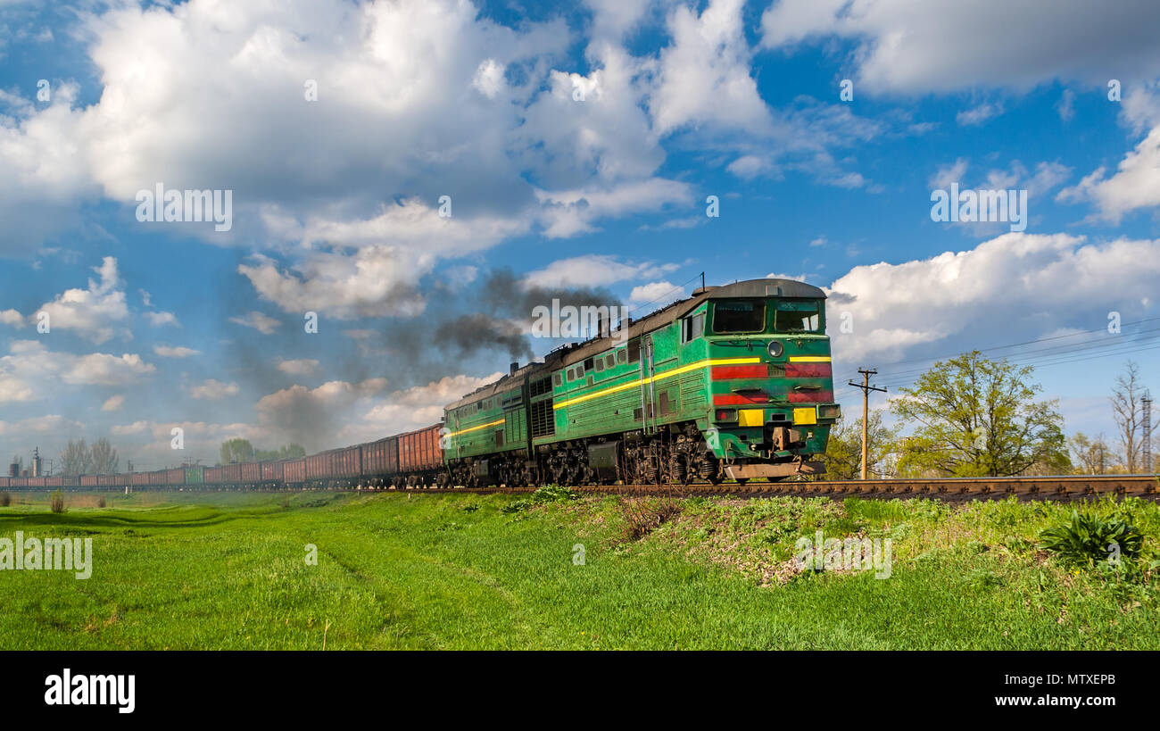 Heavy freight train hauled by diesel locomotive Stock Photo - Alamy