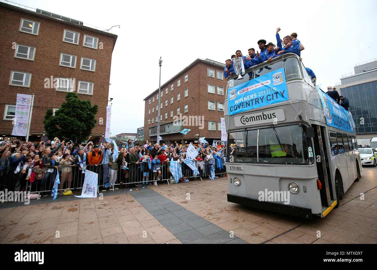 Coventry City players (right) during the Sky Bet League Two promotion ...