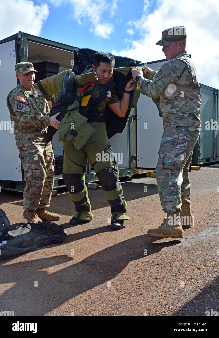 SCHOFIELD BARRACKS, Hawaii- Staff Sgt. Michael Walker (left) and Spc ...